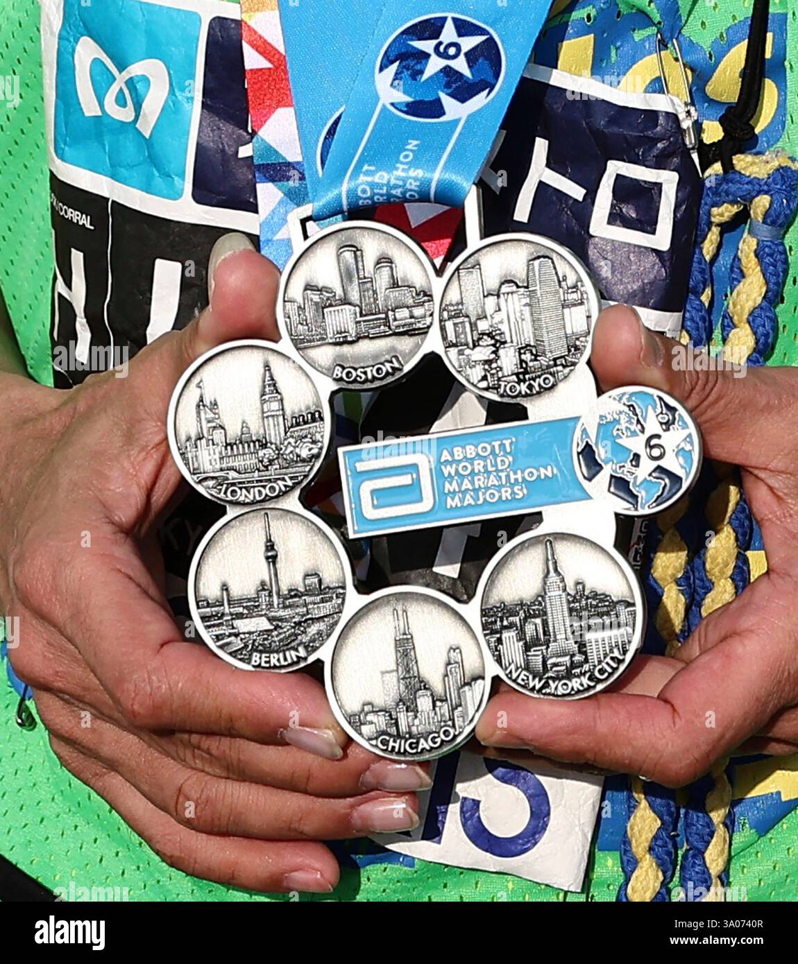 A photo shows the Six Star Finisher medal, awarded to runners who ...