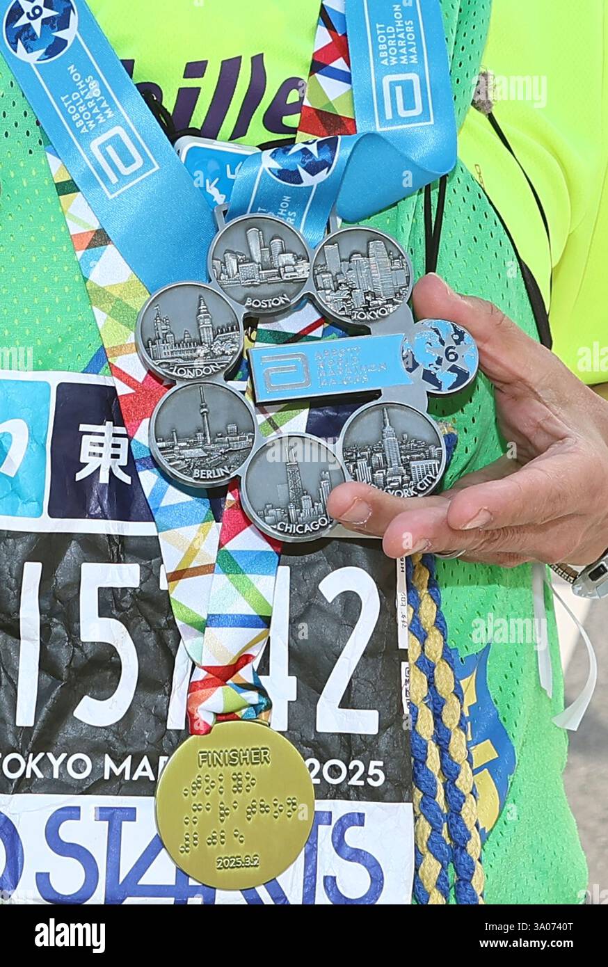 A photo shows the Six Star Finisher medal, awarded to runners who ...