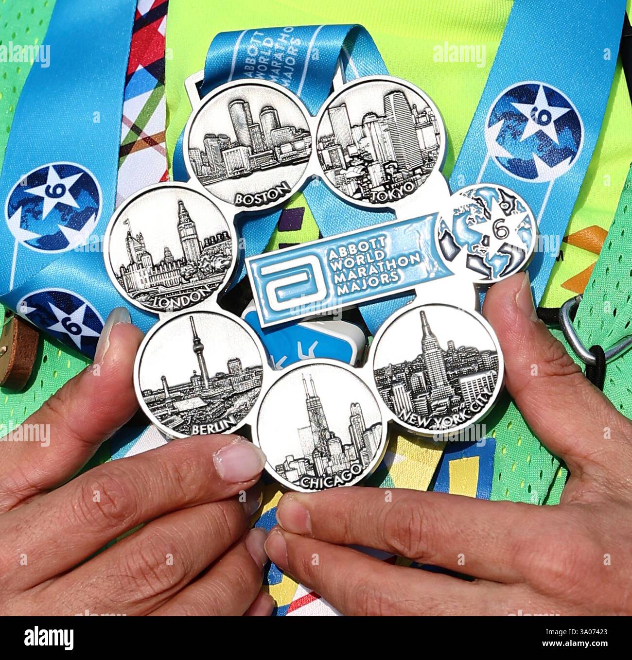 A photo shows the Six Star Finisher medal, awarded to runners who ...