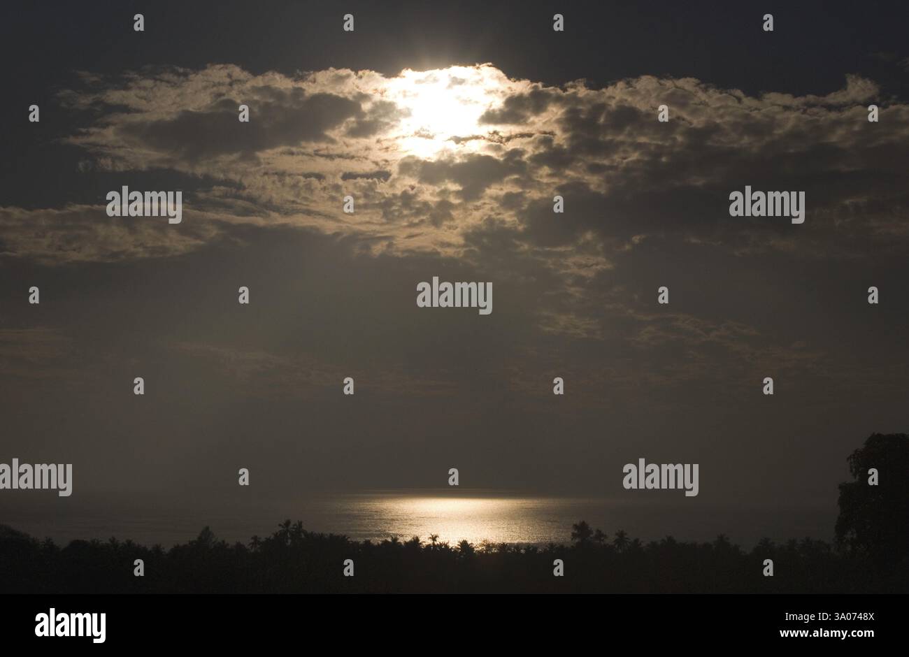 Sunset on Arabian sea and beautiful sky with clouds at Anjarle beach ...