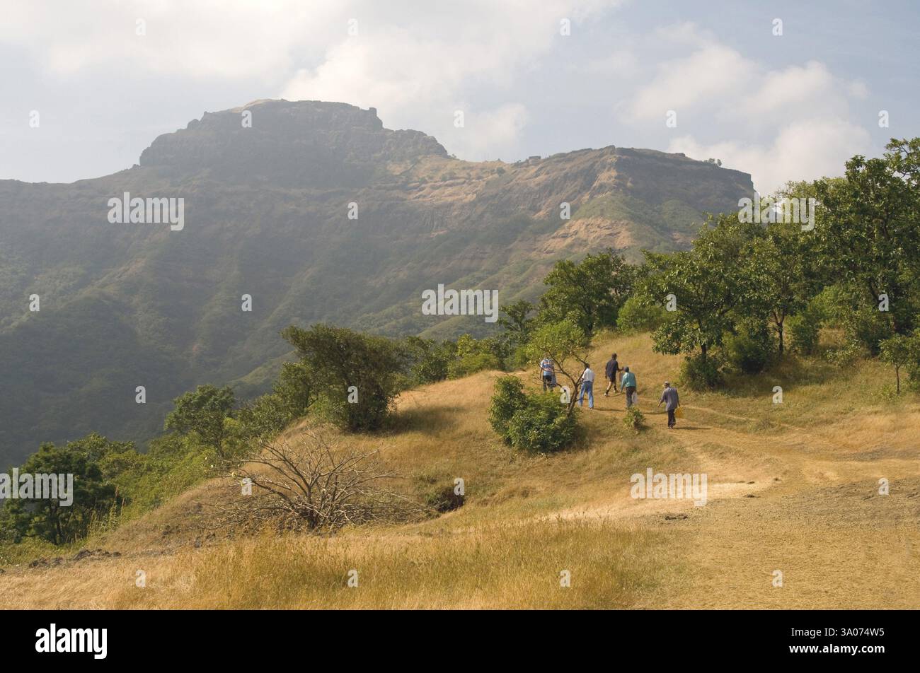 Mountain range and trekkers in valley of Rajgad fort, District Pune ...