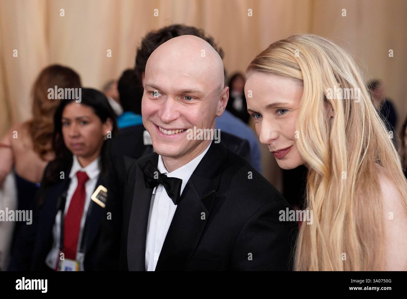 Yura Borisov, left, and Anna Borisova arrive at the Oscars on Sunday ...