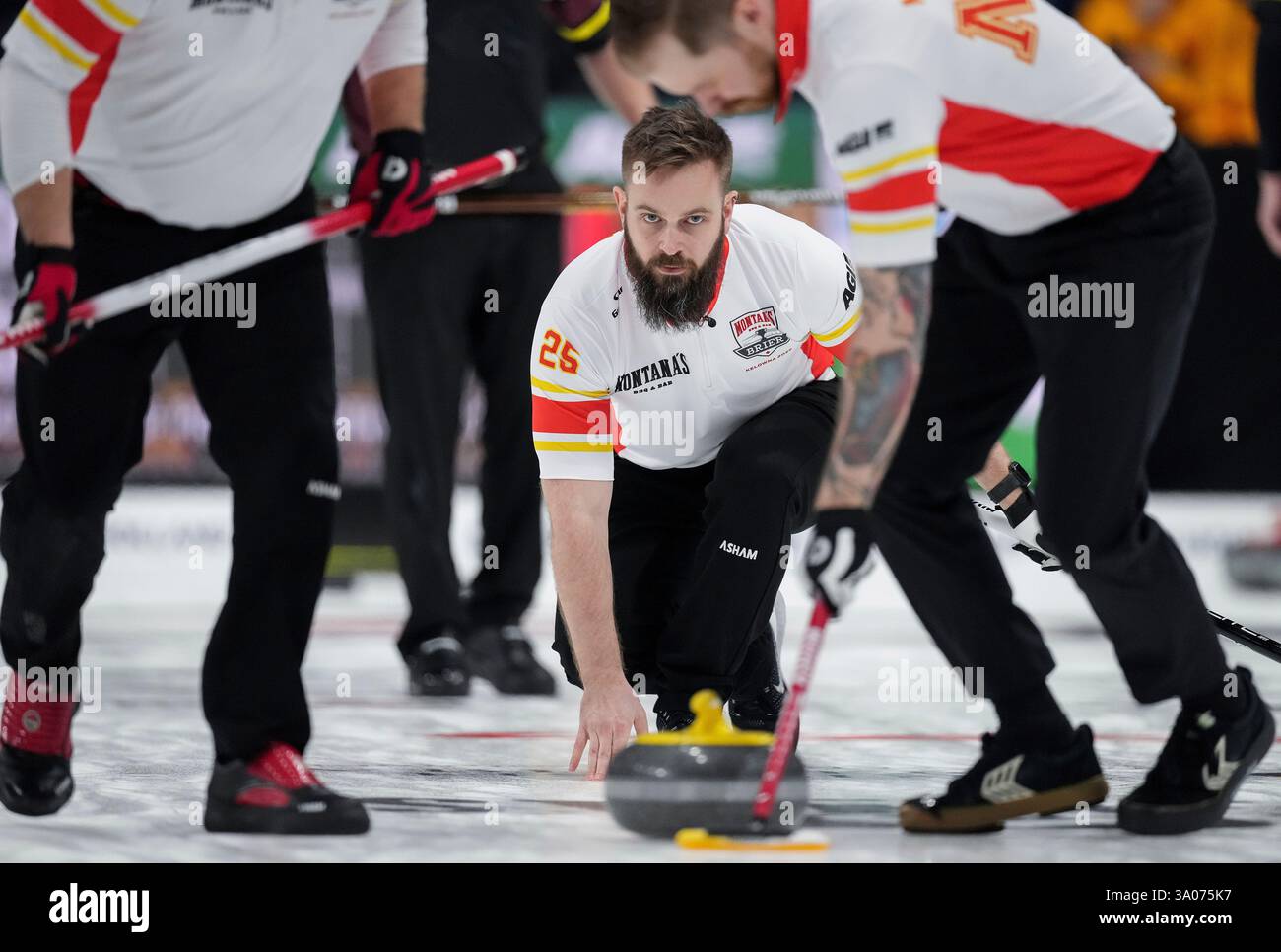 Nunavut skip Shane Latimer watches his shot while playing New Brunswick ...