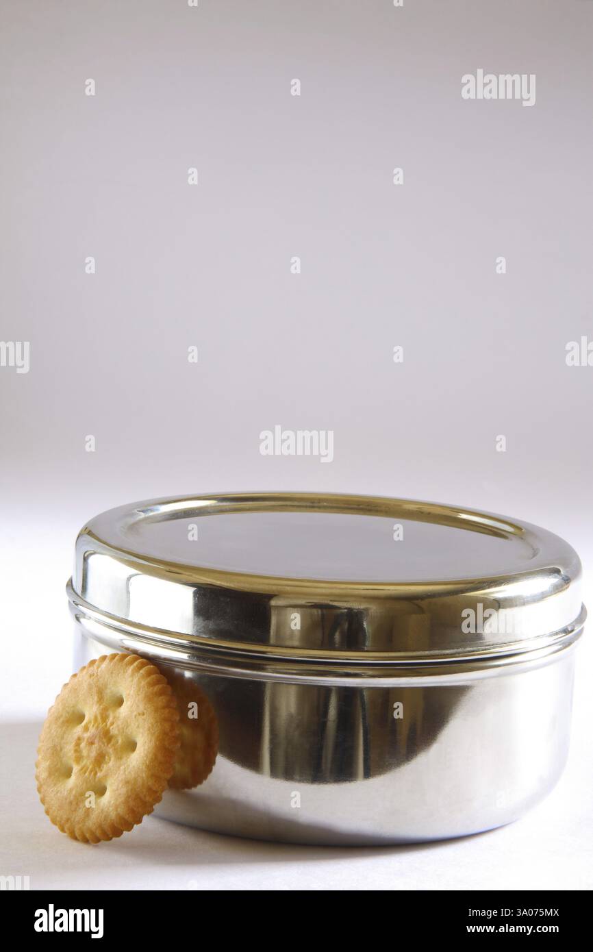 Box, steel container and biscuits, India, Asia Stock Photo - Alamy