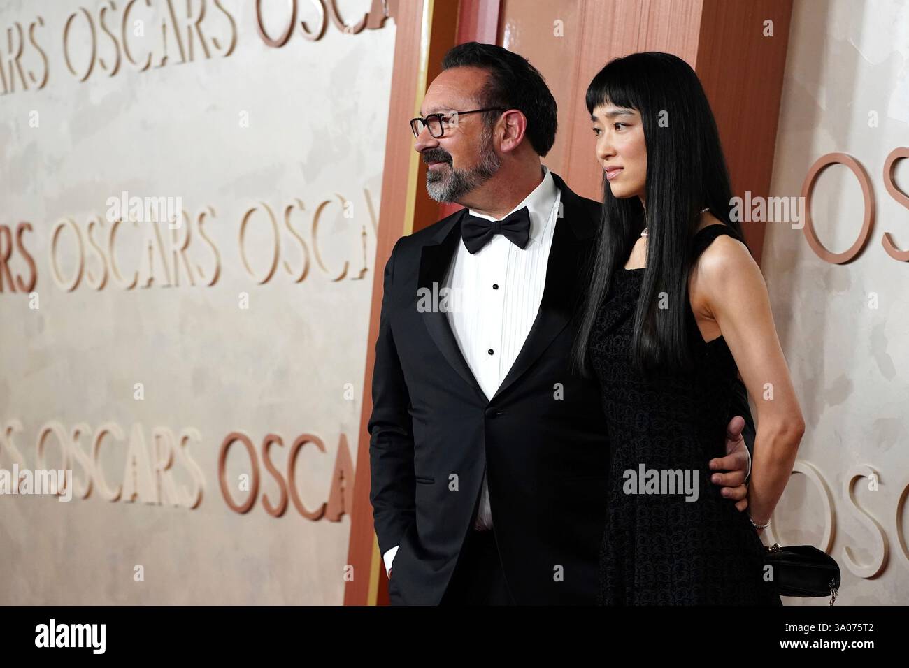 James Mangold, left, and Eriko Hatsune arrive at the Oscars on Sunday ...