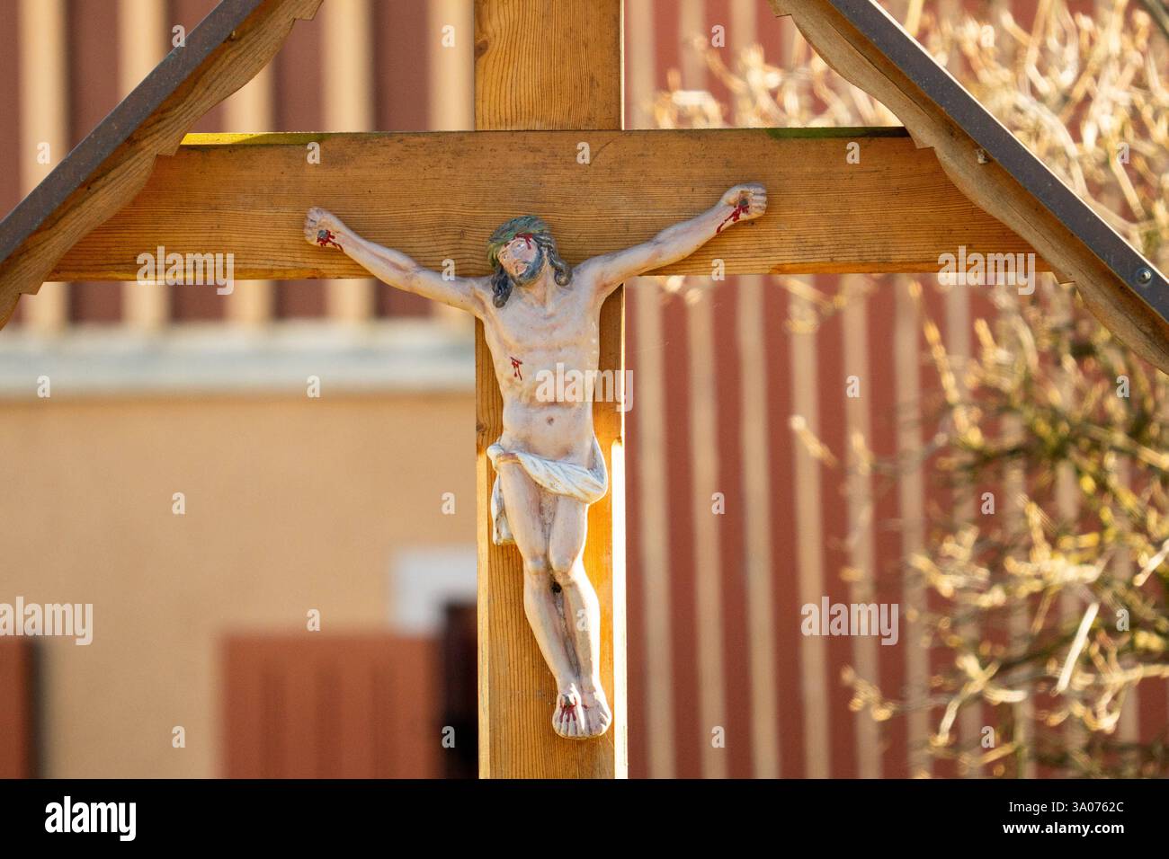 Bavaria, Germany - 2 March 2025: A wooden wayside cross with a figure ...