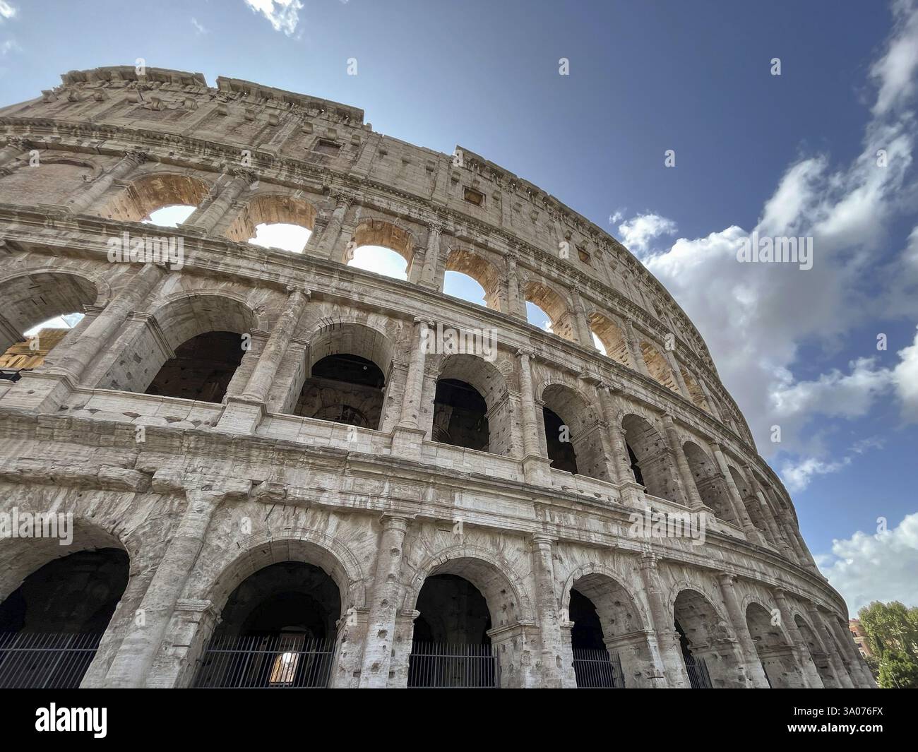 Majestic Colosseum, taken from below with a view of its arches and the ...