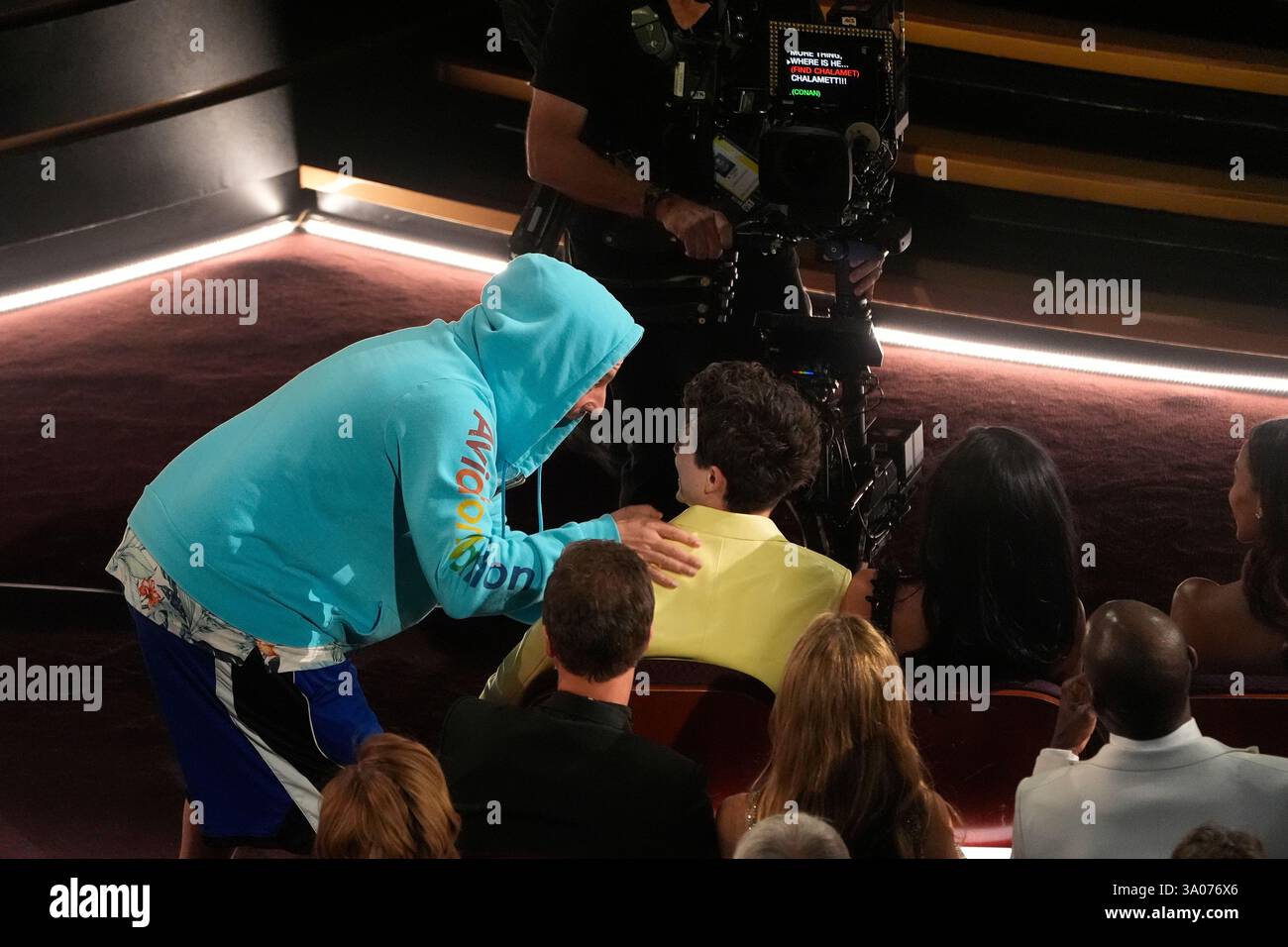 Adam Sandler, left, and Timothee Chalamet in the audience during the ...