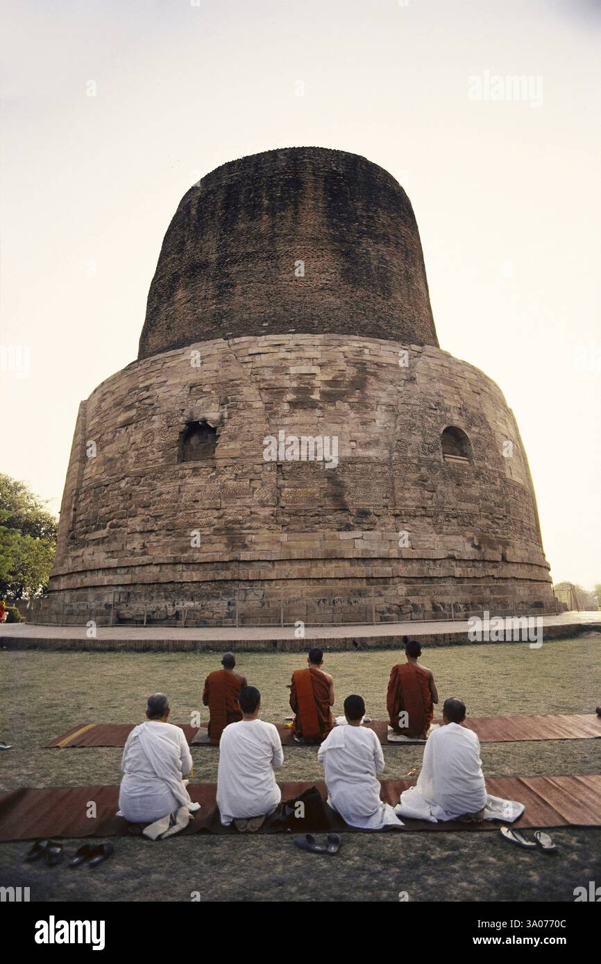 Buddhist monks bowing in prayer, Sarnath, Varanasi, Uttar Pradesh ...