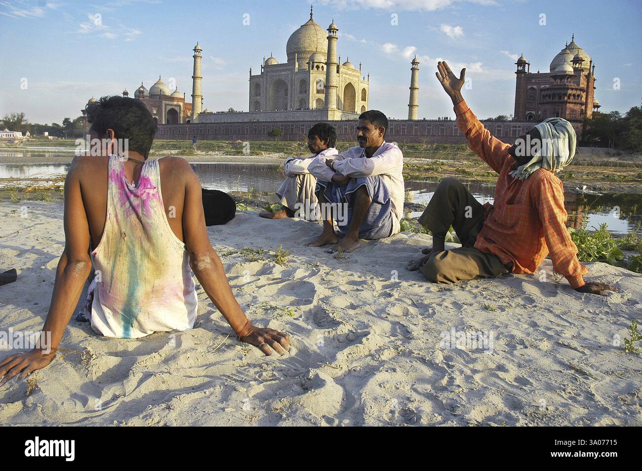 Local folk singer singing praises Taj banks river Yamuna flowing Taj ...