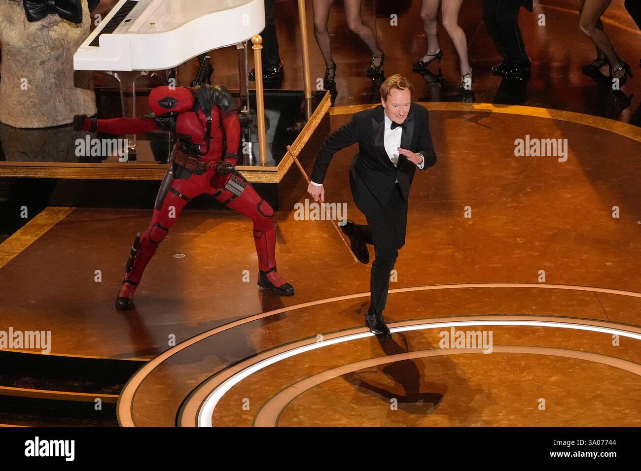 Dancing Deadpool, left, and Host Conan O'Brien perform during the ...
