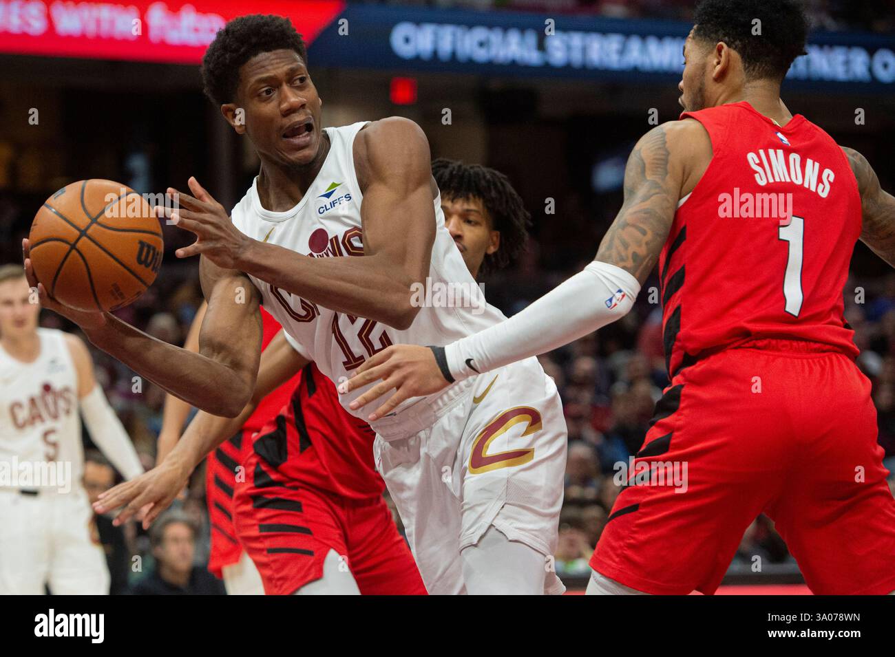 Cleveland Cavaliers' De'Andre Hunter (12) looks to. pass the ball ...