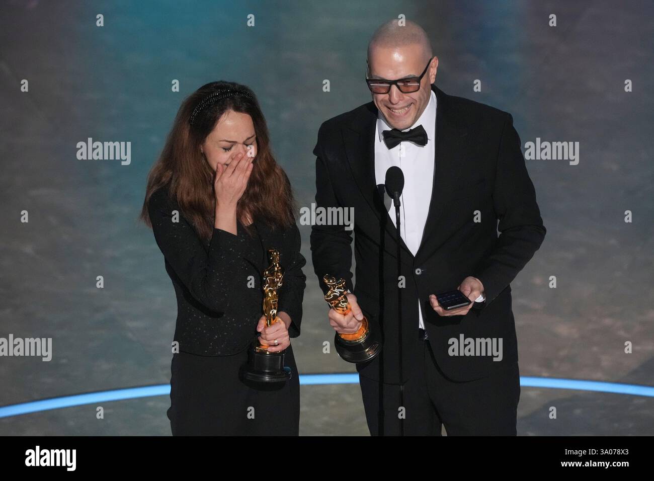 Shirin Sohani, left, and Hossein Molayemi accepts the award for best animated short for "In the ...