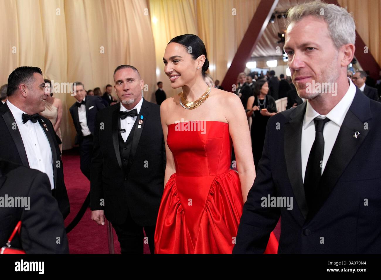 Gal Gadot, left, and Jaron Varsano arrive at the Oscars on Sunday ...