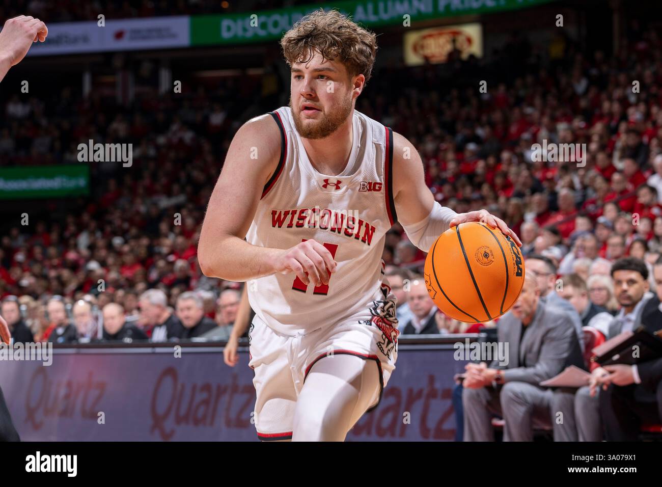 Wisconsin Badgers guard Max Klesmit (11) handles the ball during an ...