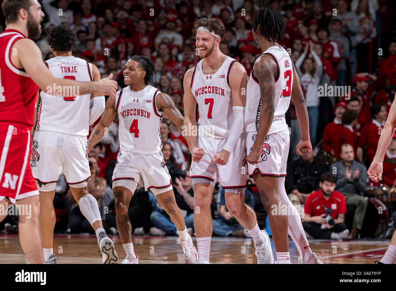 Wisconsin Badgers guard Kamari McGee (4) Carter Gilmore (7) and Xavier ...