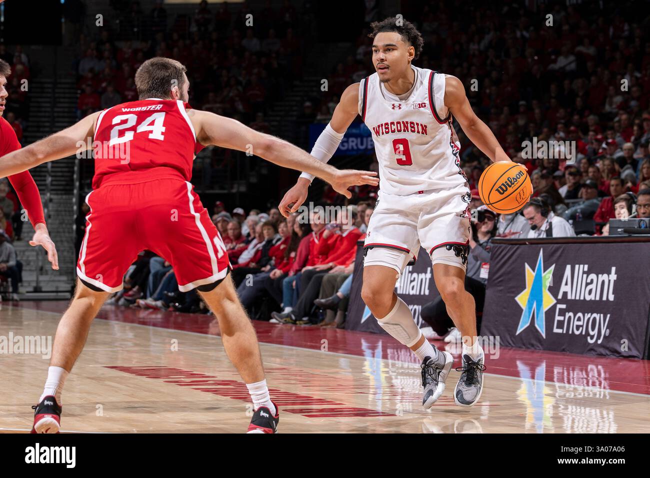Wisconsin Badgers guard John Tonje (9) handles the ball during an NCAA ...