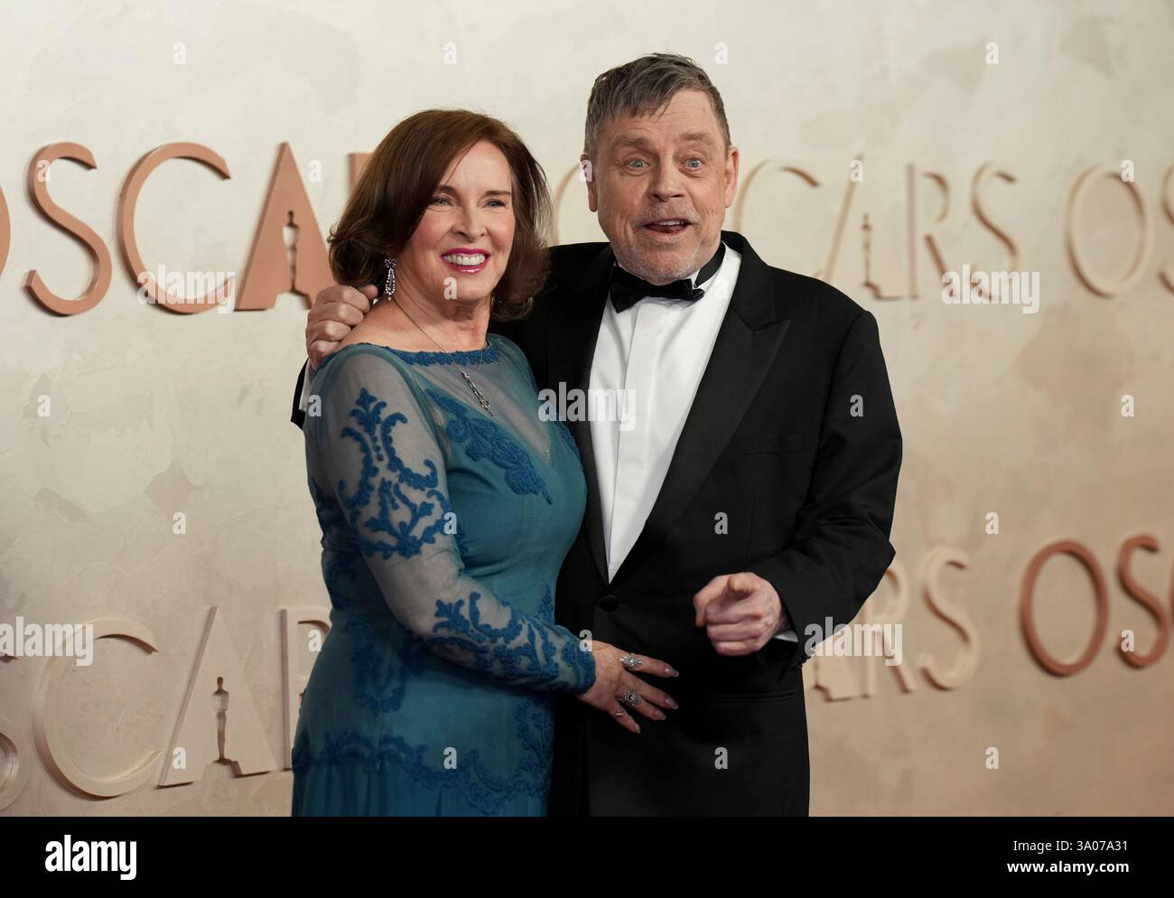 Marilou York, left, and Mark Hamill arrive at the Oscars on Sunday ...