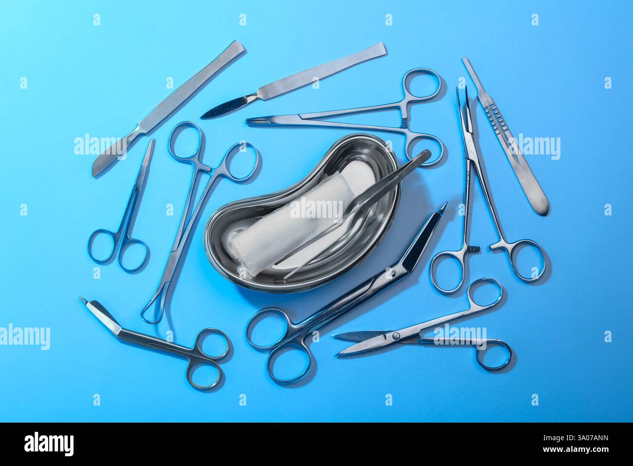 Different surgical instruments on light blue background, flat lay Stock ...