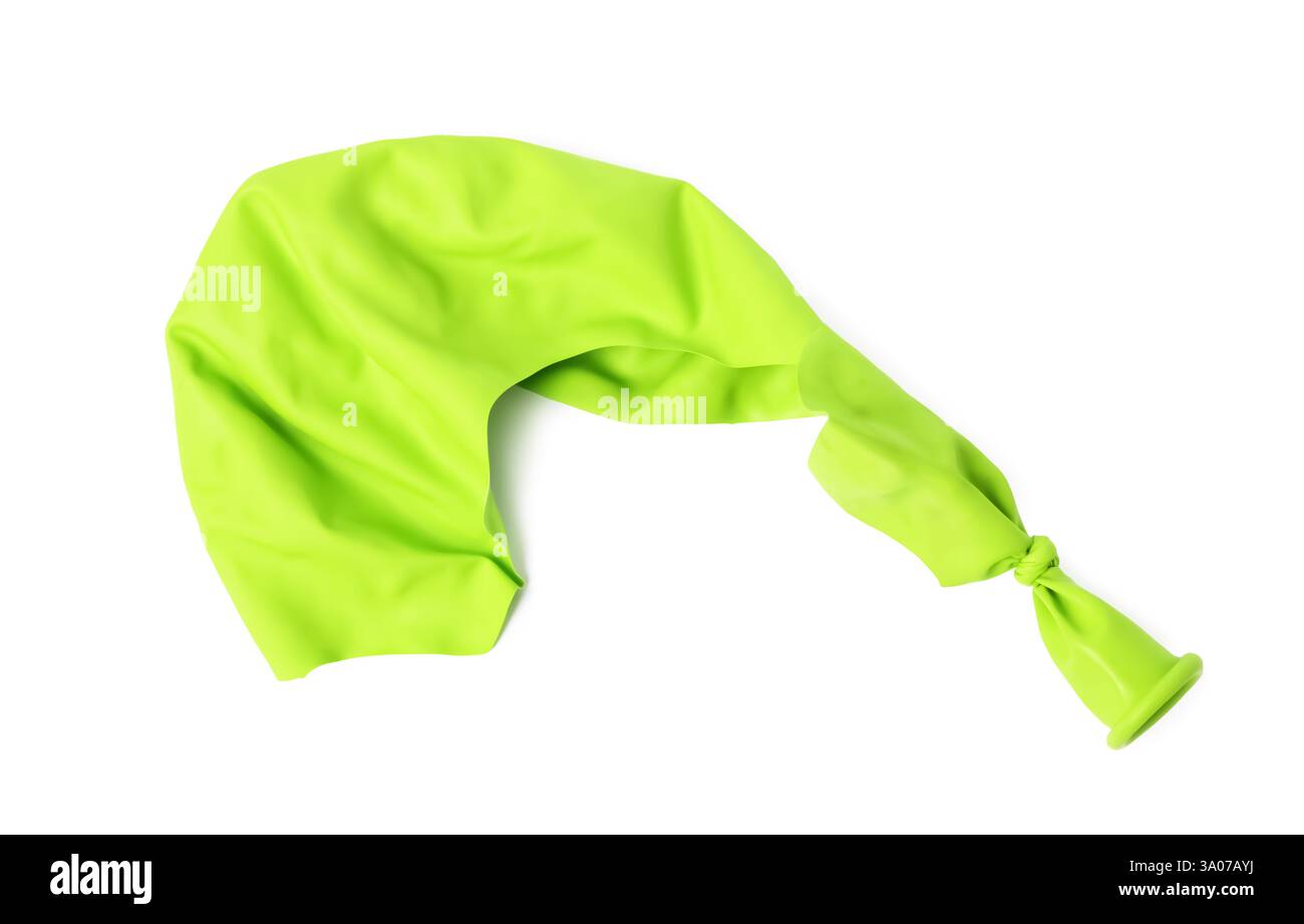 One green popped balloon isolated on white Stock Photo - Alamy