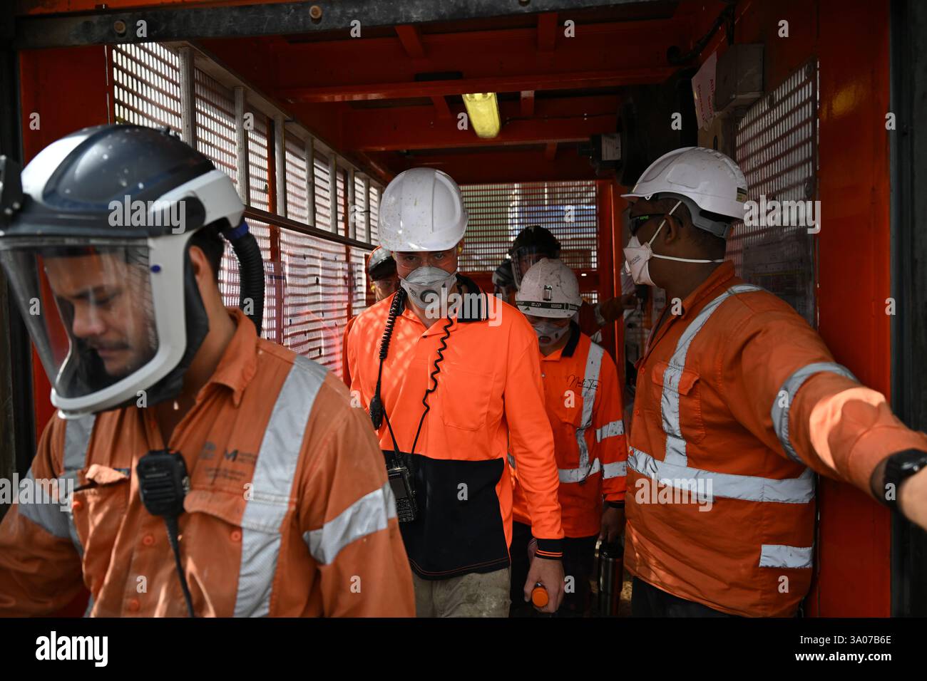 Sydney, Australia. 03rd Mar, 2025. Construction workers exit a lift ...