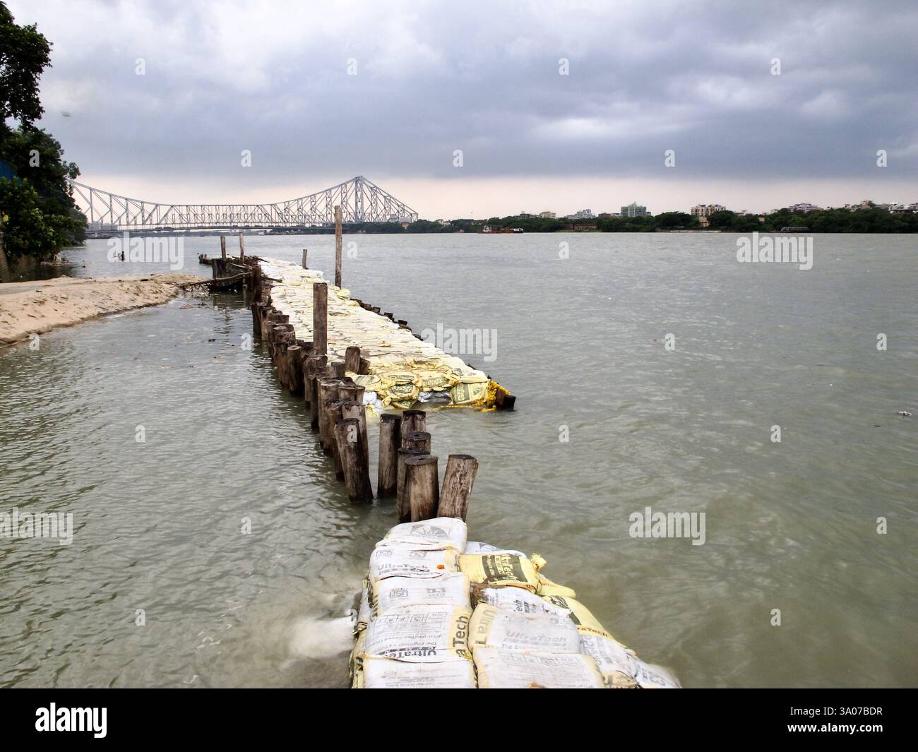 A temporary flood barrier along the Hooghly River in Kolkata, West ...
