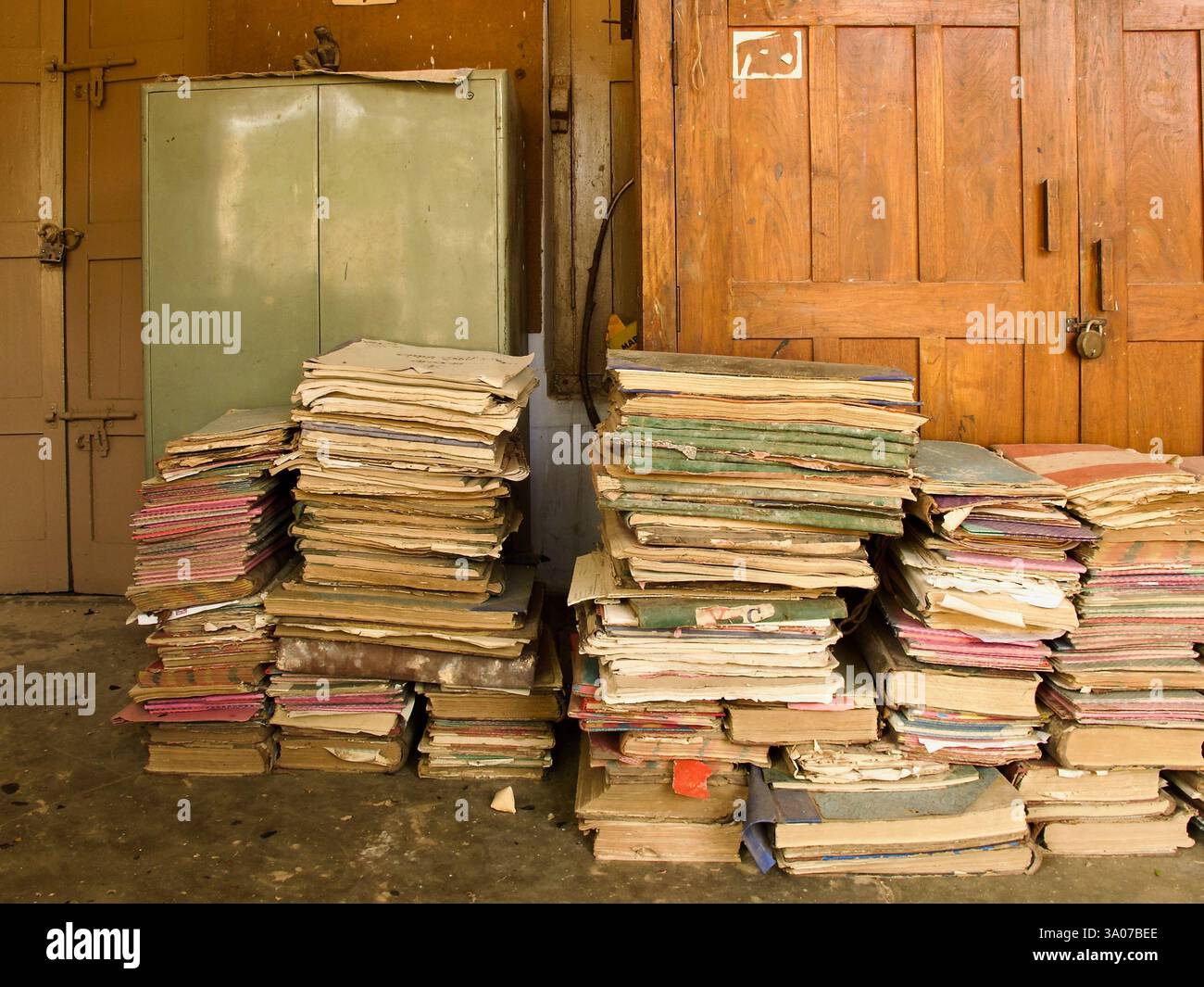 Stacks of old, deteriorating files in a government office, illustrating ...