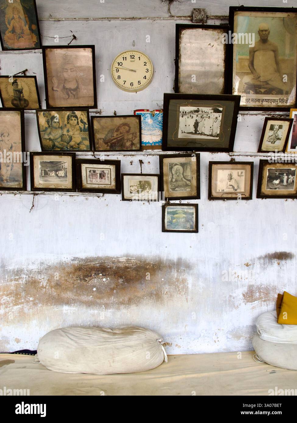 Monks’ seating area adorned with framed images in a Bodh Gaya temple ...