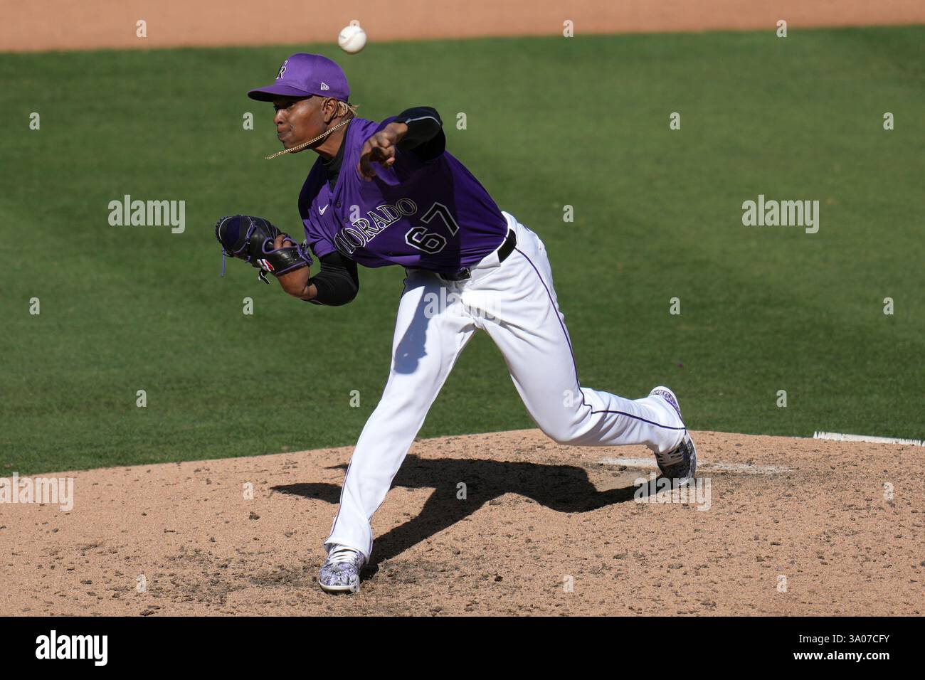 Colorado Rockies pitcher Jefry Yan throws a third strike against ...