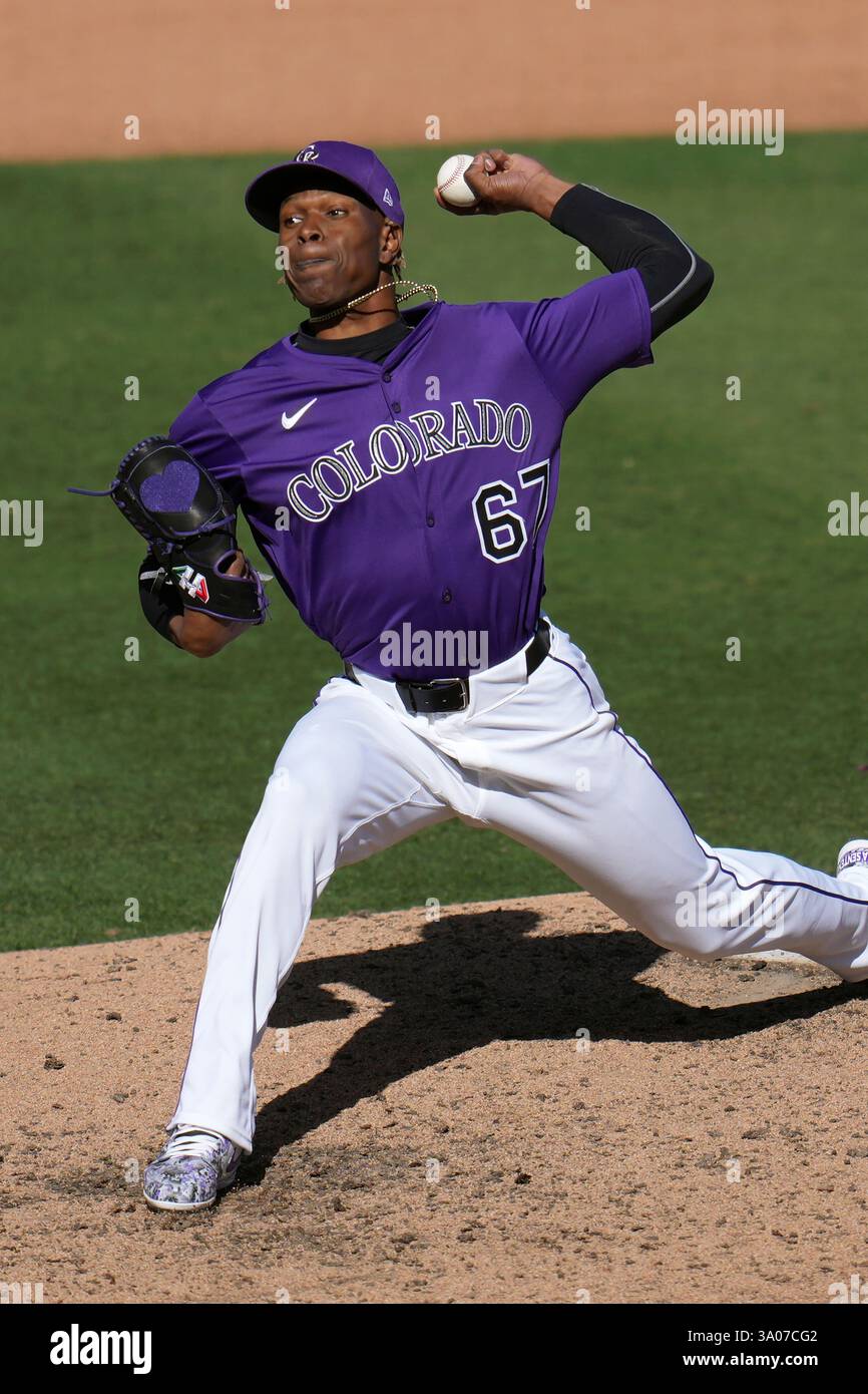 Colorado Rockies pitcher Jefry Yan throws against the Seattle Mariners ...