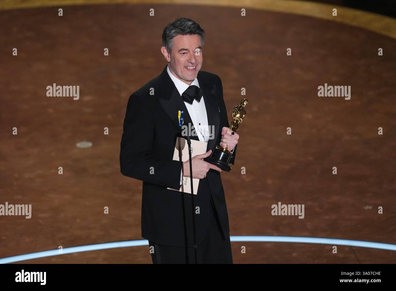 Peter Straughan accepts the award for best adapted screenplay for ...