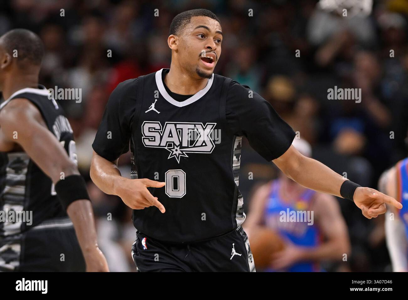 San Antonio Spurs' Keldon Johnson celebrates a basket during the first ...