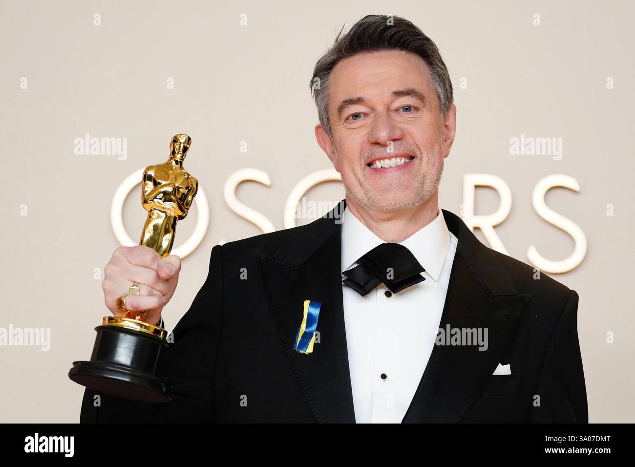 Peter Straughan, winner of the award for best adapted screenplay for ...