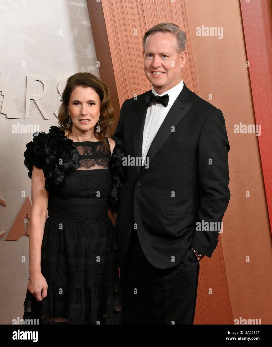 Mike Cavanagh (on the right) arrives on the red carpet for the 97th ...