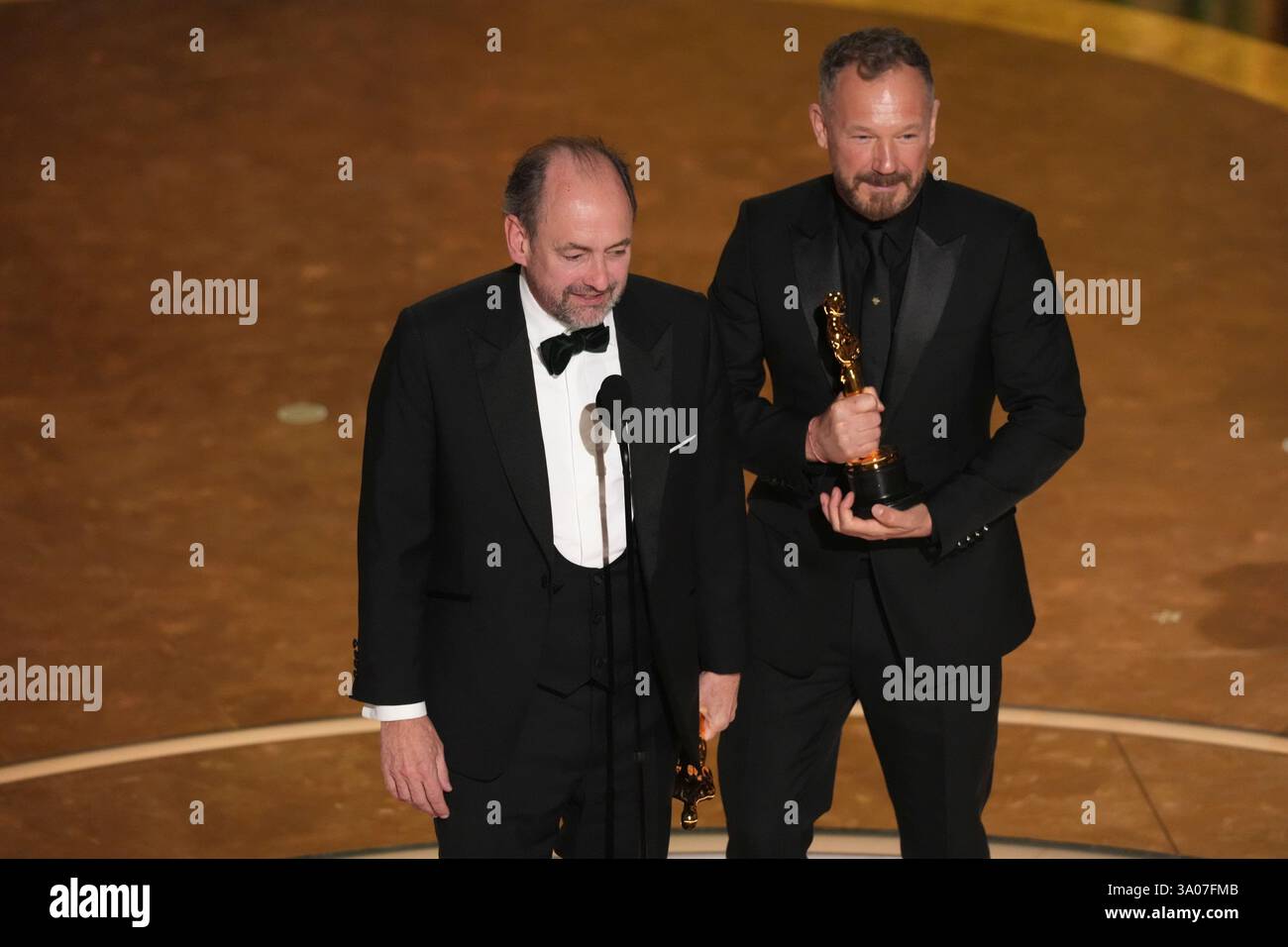 Nathan Crowley, left, and Lee Sandales accept the award for best ...