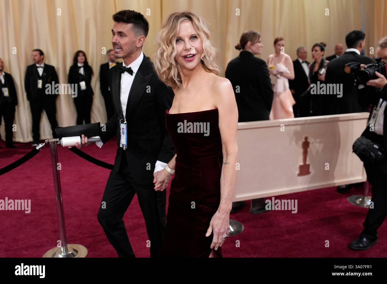 Meg Ryan arrives at the Oscars on Sunday, March 2, 2025, at the Dolby ...