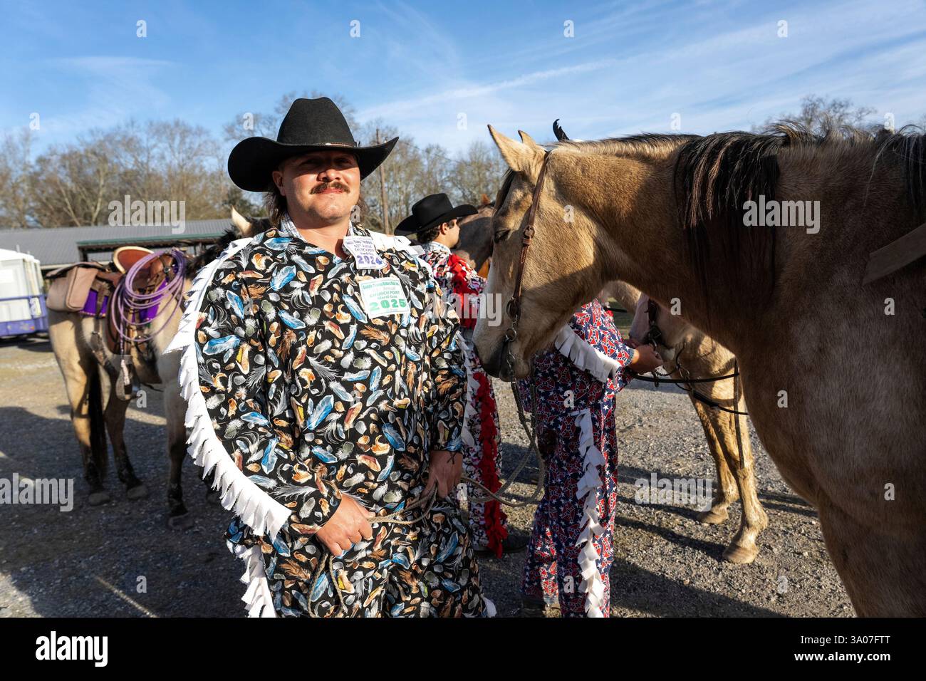 Parade participants are seen during the Church Point Courir de Mardi ...