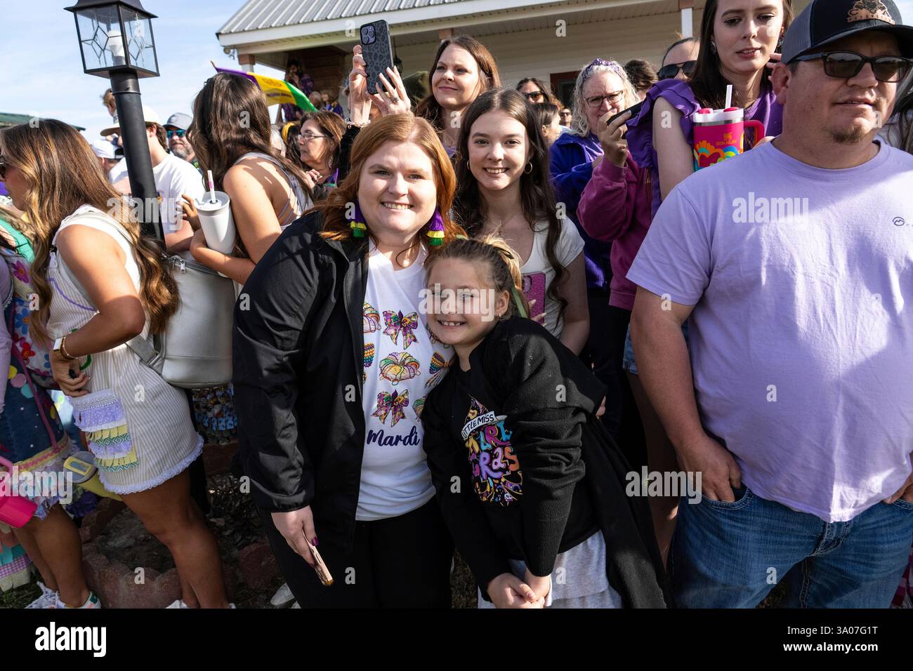 Paradegoers are seen during the Church Point Courir de Mardi Gras ...