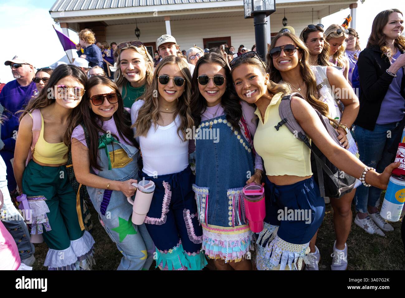 Paradegoers are seen during the Church Point Courir de Mardi Gras ...