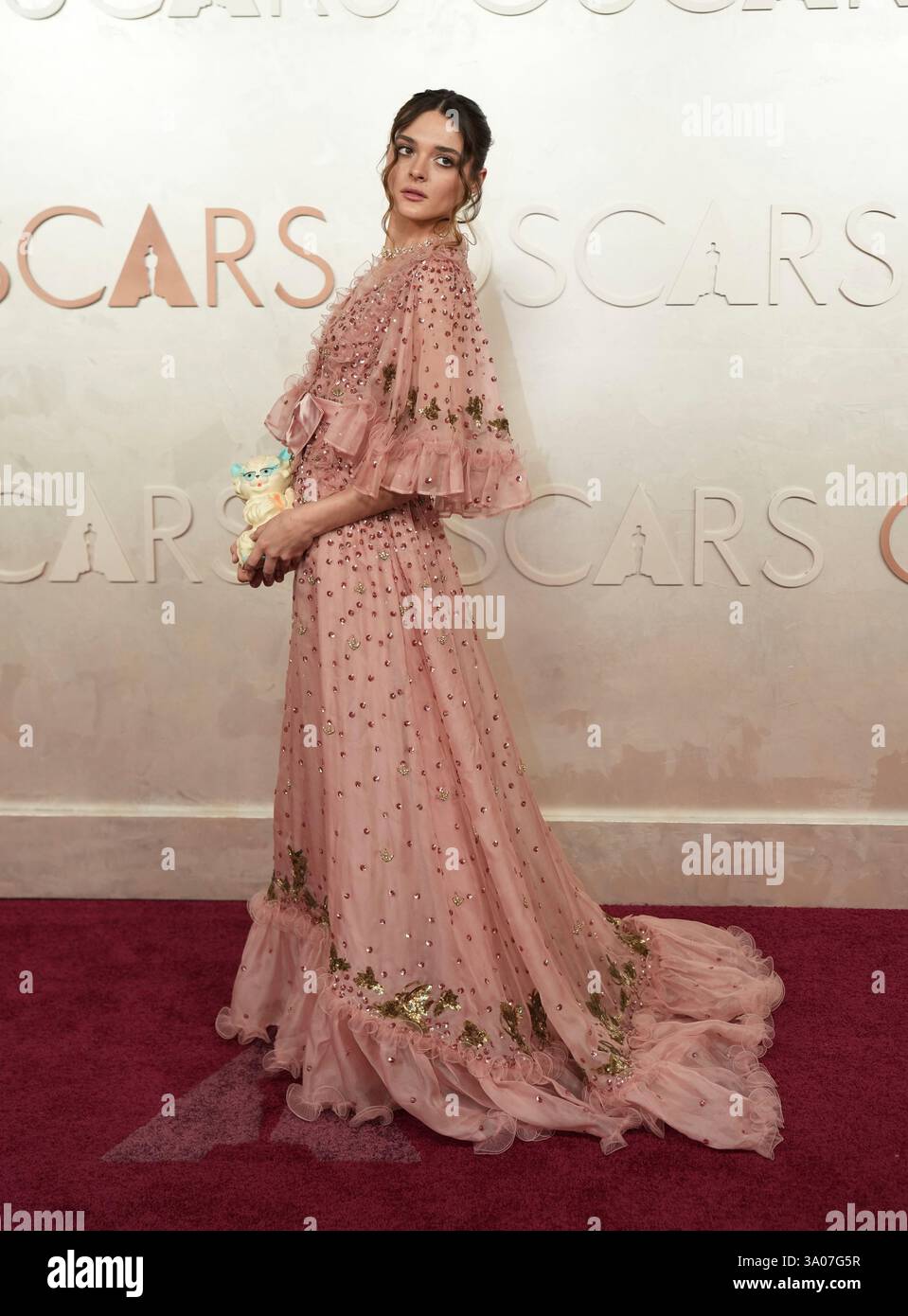 Charlotte Lawrence arrives at the Oscars on Sunday, March 2, 2025, at ...