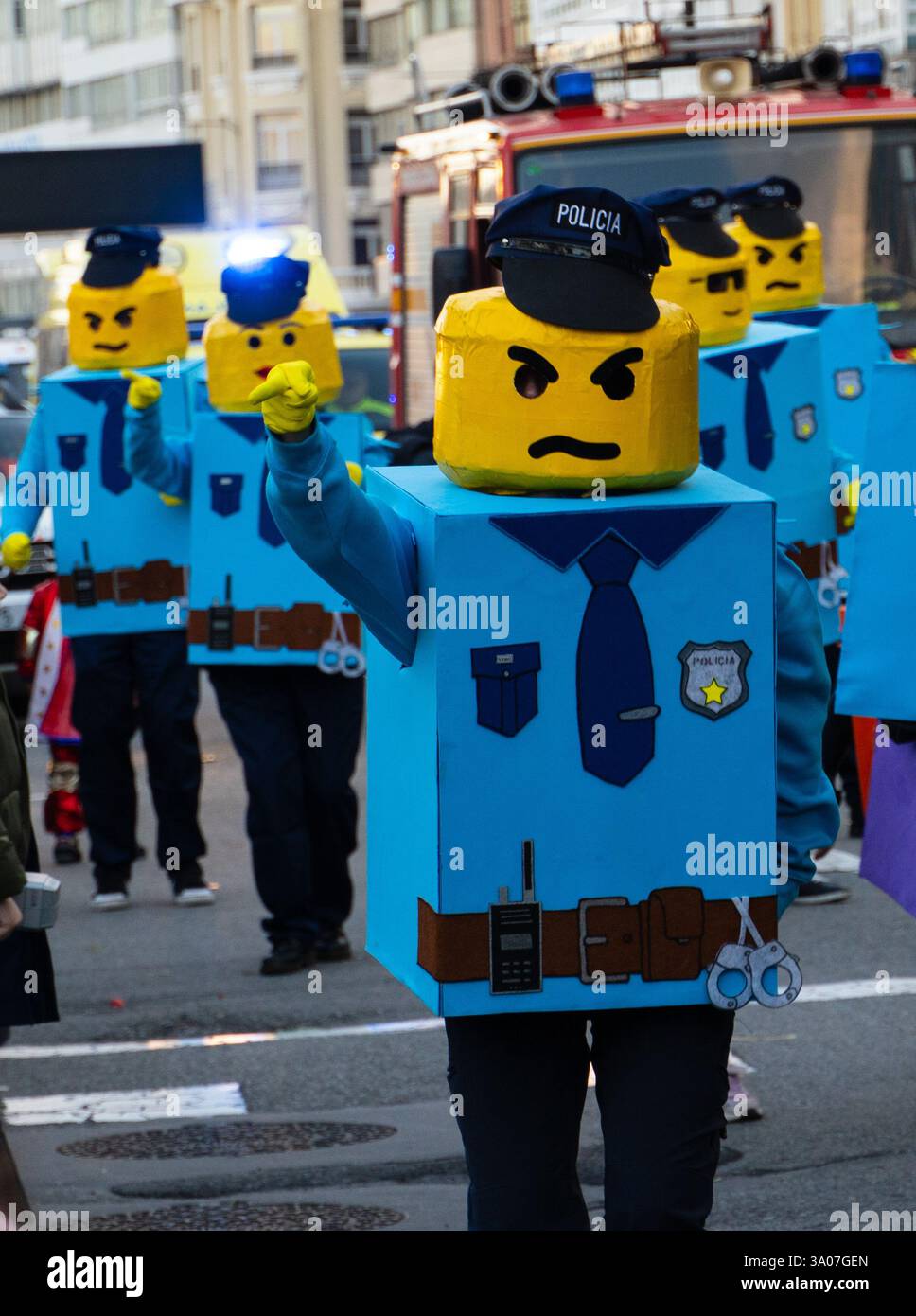 People dressed up as police officers made from Lego blocks at a ...