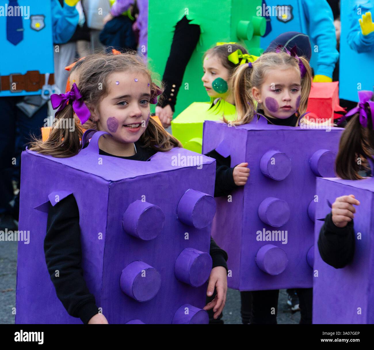 Children dressed as purple lego blocks at a carnival Stock Photo - Alamy
