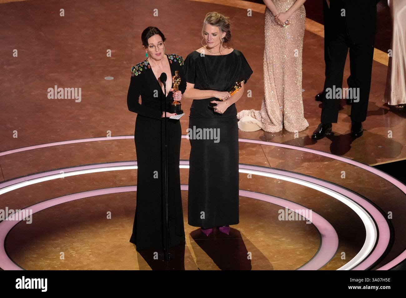 Molly O'Brien, left, and Lisa Remington accept the award for best documentary short film for ...