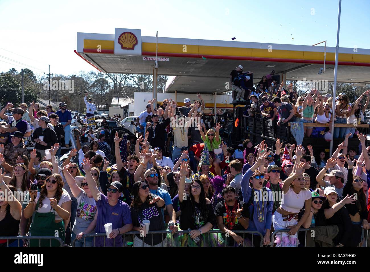 Paradegoers are seen during the Church Point Courir de Mardi Gras ...