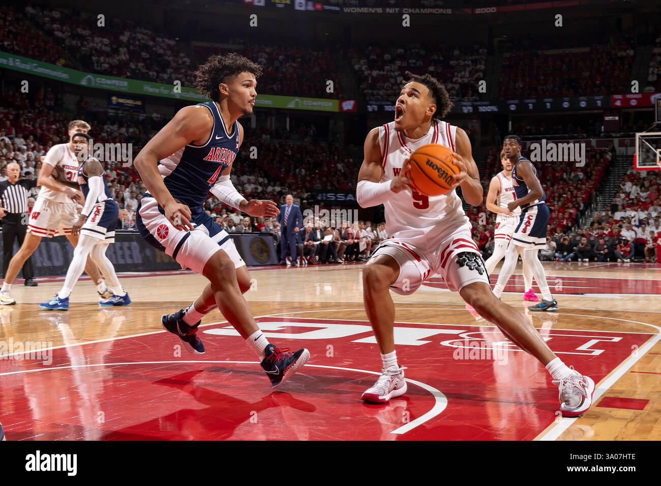 Wisconsin Badgers guard John Tonje (9) handles the ball during an NCAA ...