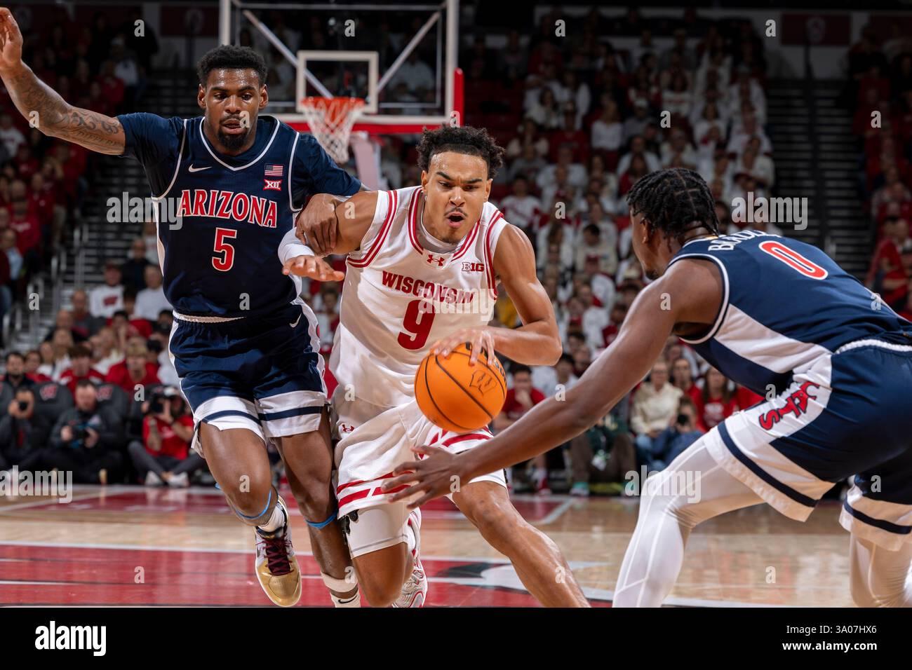 Wisconsin Badgers guard John Tonje (9) handles the ball during an NCAA ...