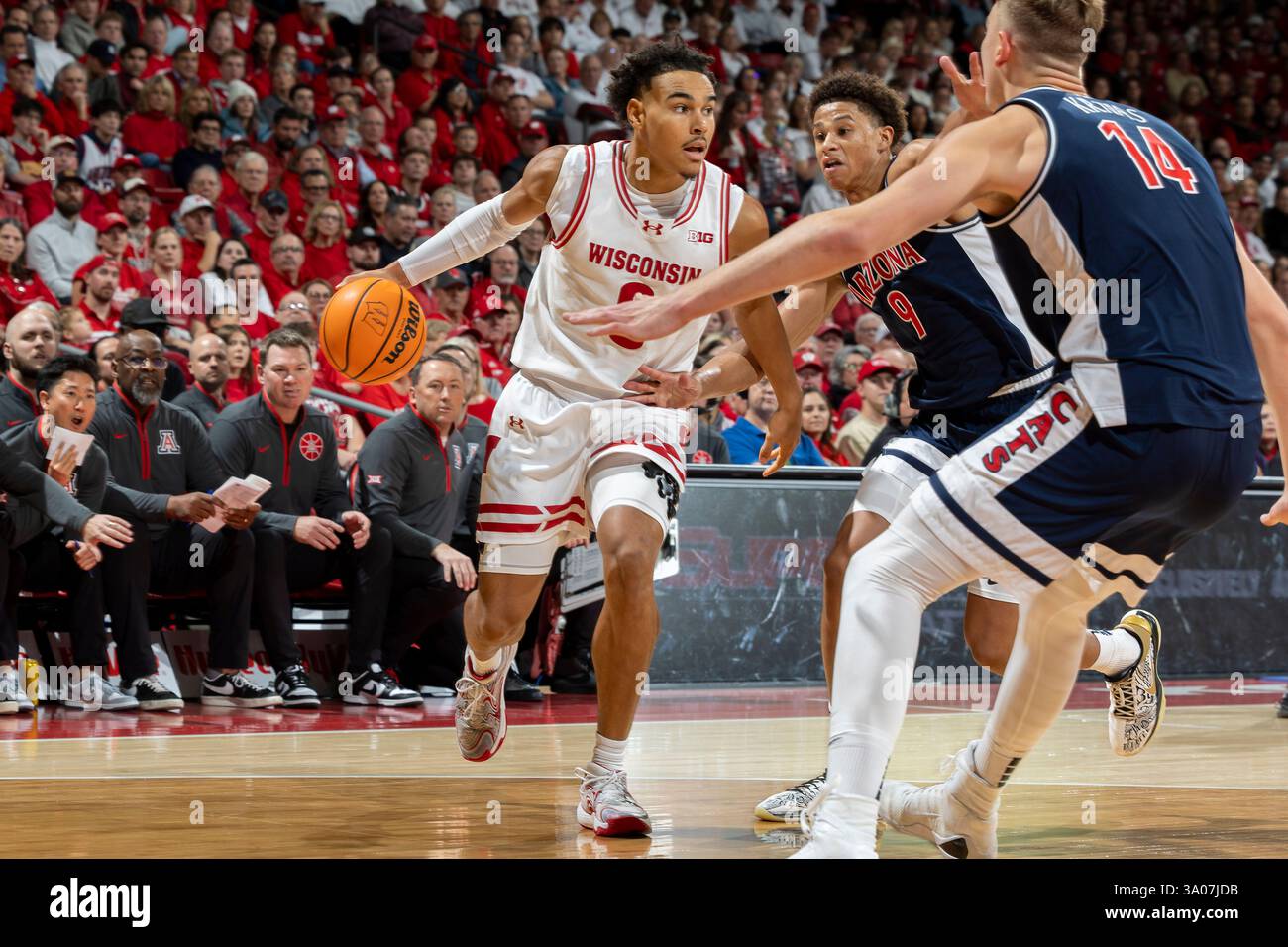 Wisconsin Badgers guard John Tonje (9) handles the ball during an NCAA ...