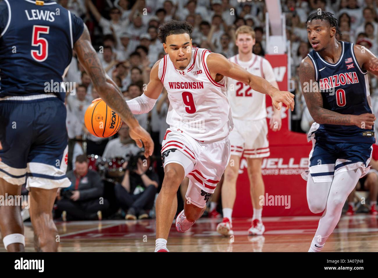 Wisconsin Badgers guard John Tonje (9) handles the ball during an NCAA ...