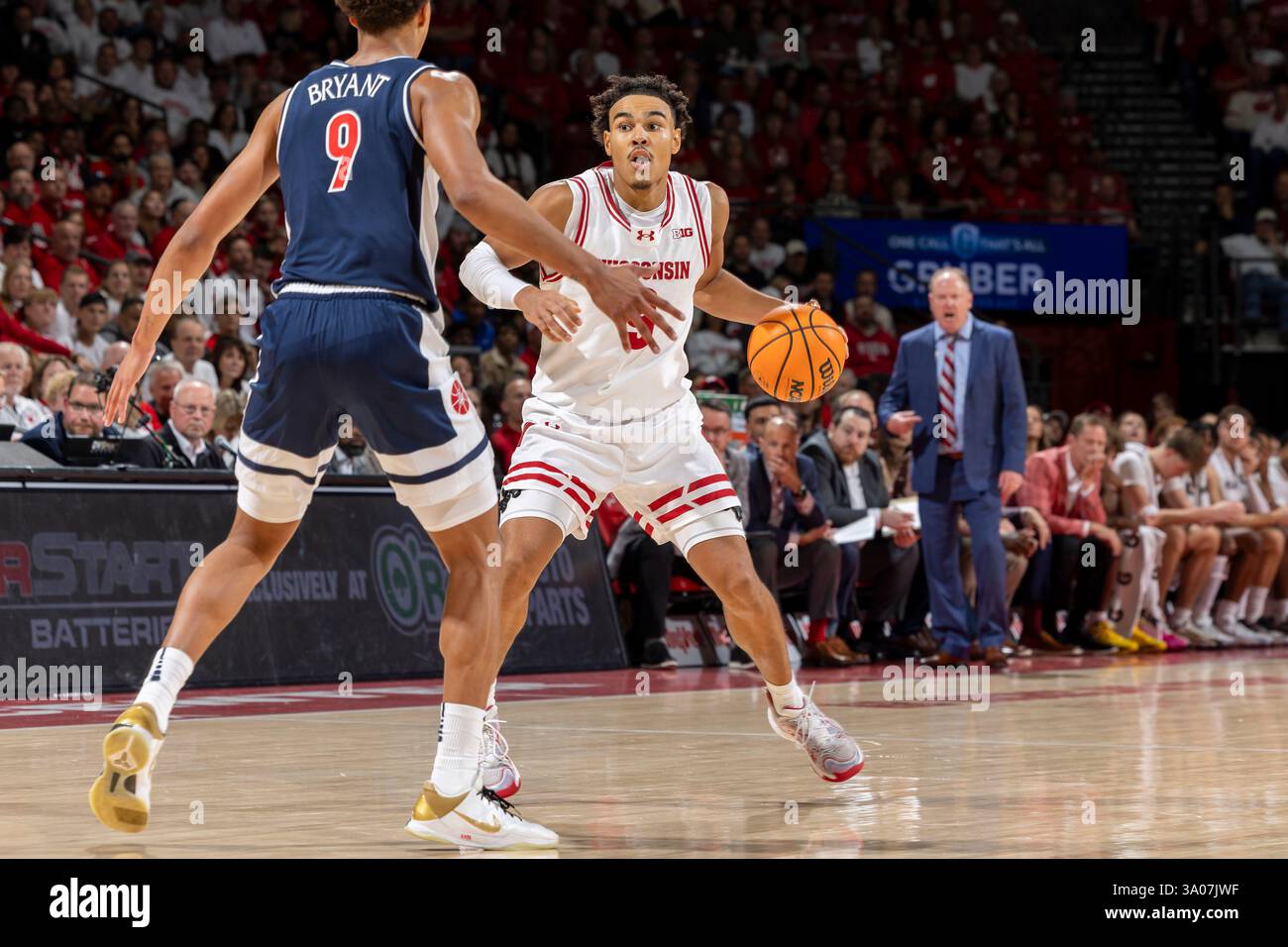 Wisconsin Badgers guard John Tonje (9) handles the ball during an NCAA ...