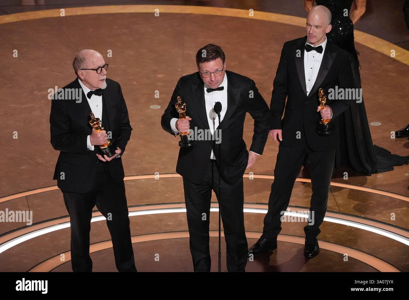 Richard King, from left, Ron Bartlett, and accept the award for best ...
